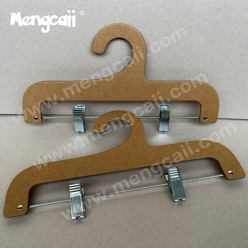 Paper pants hangers of cardboard hangers and hardware clips. The clips ...